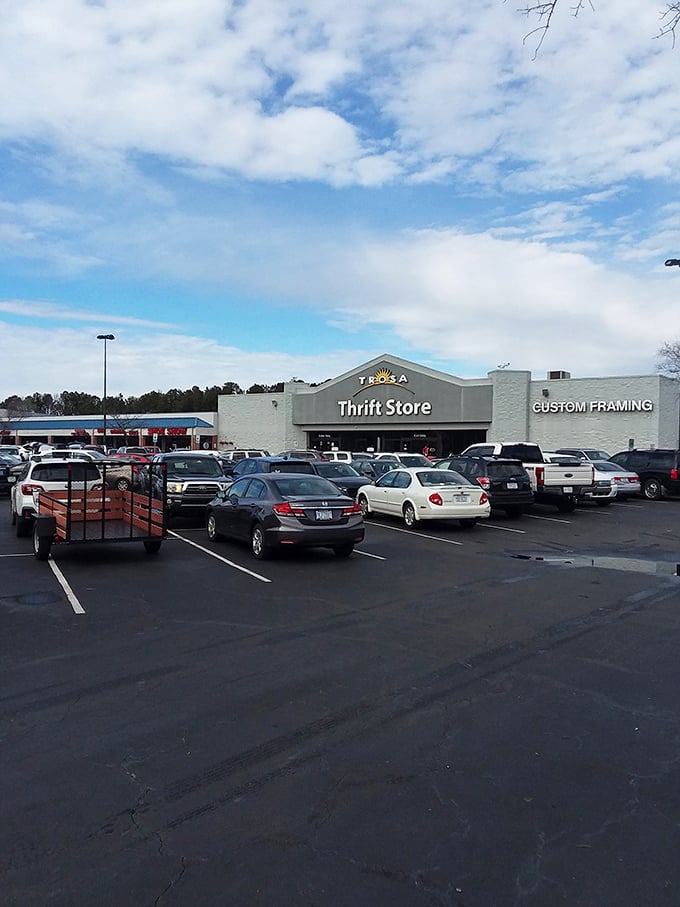 A packed parking lot—the universal sign of "get in here, the bargains are going fast!" that creates a pavlovian response in seasoned thrifters. 