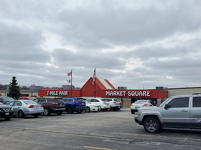 Even the parking lot tells a story—cars from across Wisconsin gather under the Market Square sign, their owners inside chasing deals.