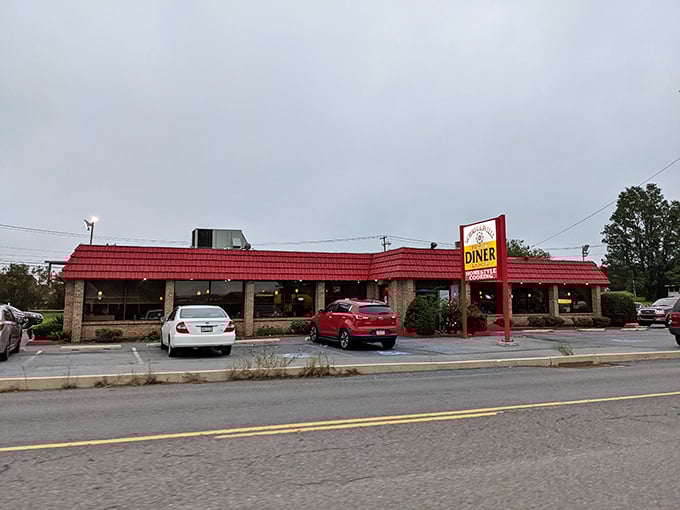 The exterior view every regular recognizes from the road. That red roof and sign have guided hungry travelers like a lighthouse for deliciousness.