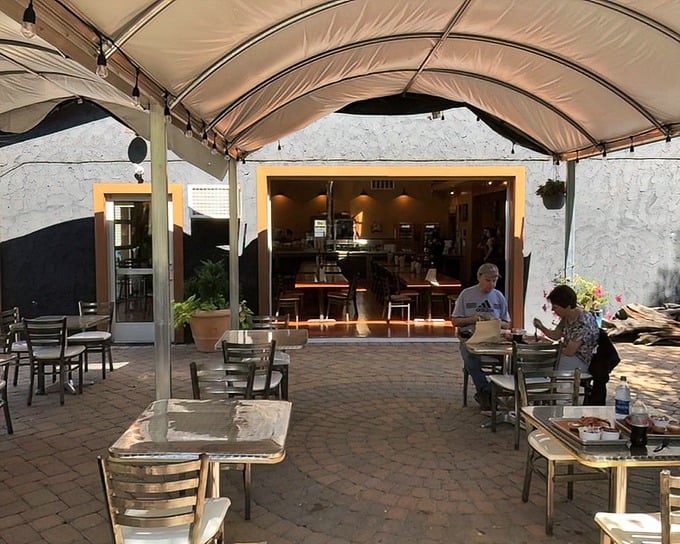 The covered patio area offers a peaceful retreat for BBQ contemplation. Indoor comfort meets outdoor freshness – the best of both worlds.