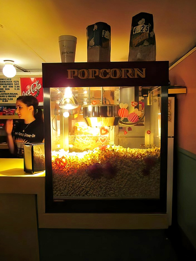 The popcorn machine glows like a treasure chest. That warm, buttery aroma has been the soundtrack's perfect companion since the first frame flickered here.