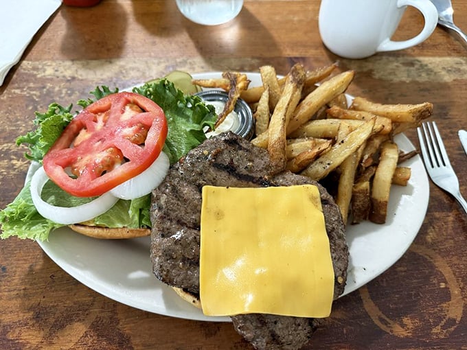 The Powerman's Burger isn't just a meal—it's a commitment. A perfectly charred patty with all the fixings and hand-cut fries worth every delicious calorie.