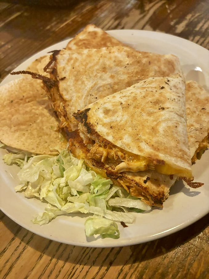 This quesadilla isn't messing around—packed with melty cheese and served with fresh lettuce, it's the handheld happiness we all deserve.