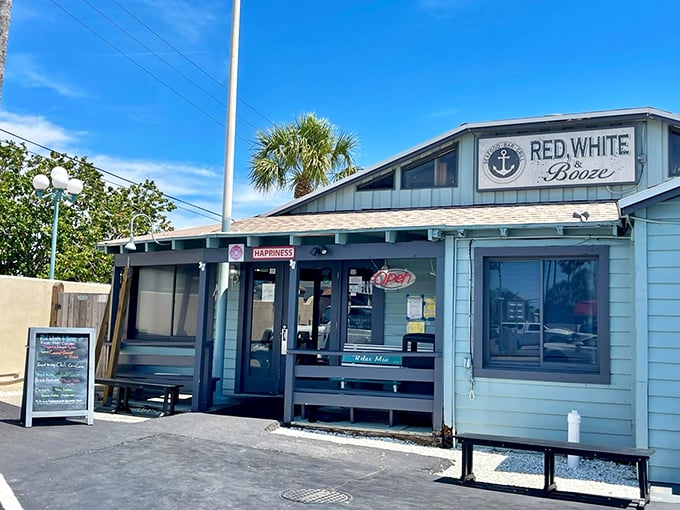 "Red, White & Booze" isn't just patriotic—it's practical. This unassuming shack serves up exactly what you need after a day of sun and sand.