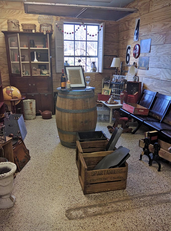 This rustic vignette with wooden barrel and vintage crates transports you to a simpler time when "storage solution" meant "wooden box." 