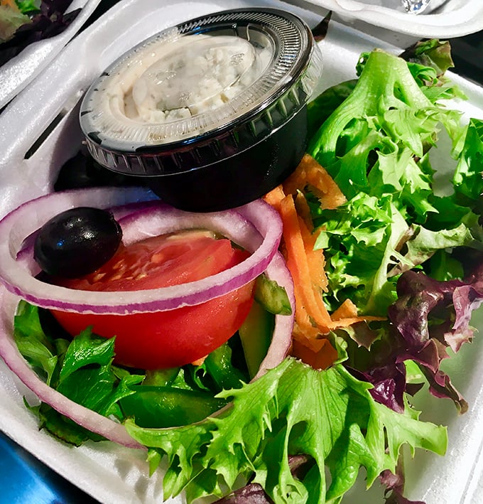 Even the salad deserves attention—crisp, colorful, and proving that vegetables can hang with the big boys when treated with proper respect.