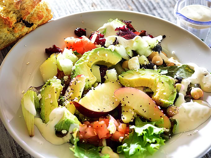 This isn't just a salad – it's a colorful celebration of fresh ingredients. Avocado, tomato, and greens dressed to impress even dedicated carnivores.
