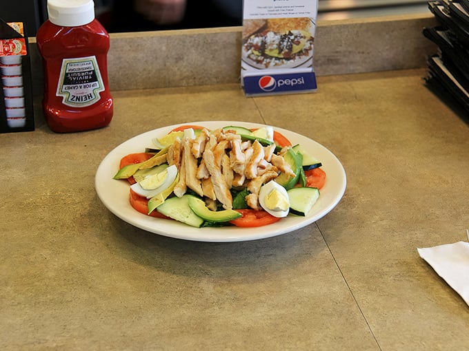 A salad that proves healthy eating doesn't have to be punishment—fresh ingredients arranged with care rather than pretension.
