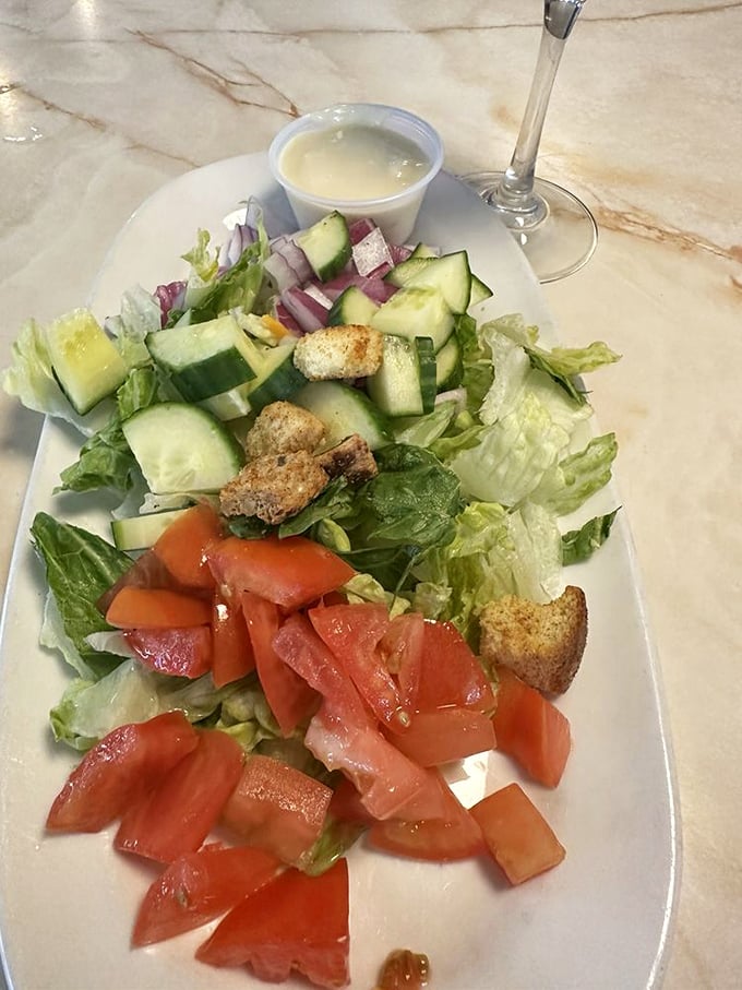 A garden-fresh salad that proves healthy options can coexist peacefully with milkshakes in the diner universe—balance achieved.