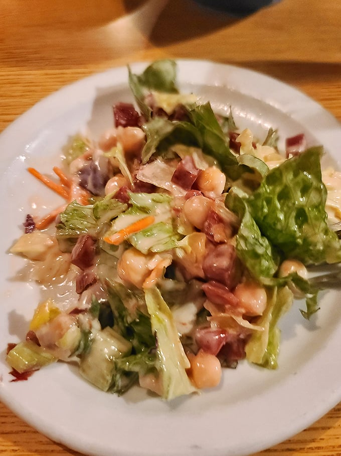 A house salad that doesn't apologize for being exactly what it should be—crisp, fresh, and ready to prepare your palate for the meaty main event.