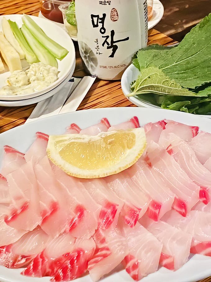 Fresh sashimi that tastes like the ocean just hand-delivered it to your table. That lemon wedge isn't just garnish – it's the perfect supporting actor.