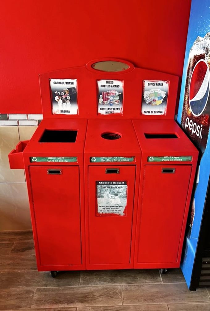 Even the trash bins match the décor—that's commitment to a theme. Red recycling stations: saving the planet while staying on brand.