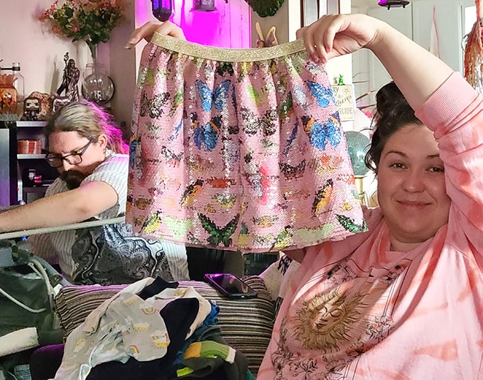 The ultimate thrift victory dance – holding up that perfect find that makes the hours of searching completely worthwhile.