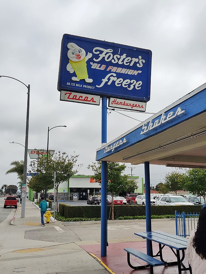 The iconic mascot stands guard, promising "Old Fashion" treats that never needed improving in the first place.