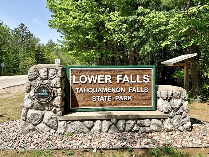 The Lower Falls sign stands as Michigan's version of a Hollywood landmark – less glamorous but infinitely more peaceful.