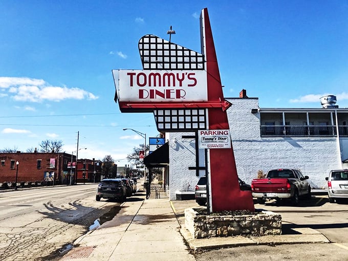 That retro sign stands like a beacon of hope for hungry travelers—a promise of comfort food that's been kept since 1989.
