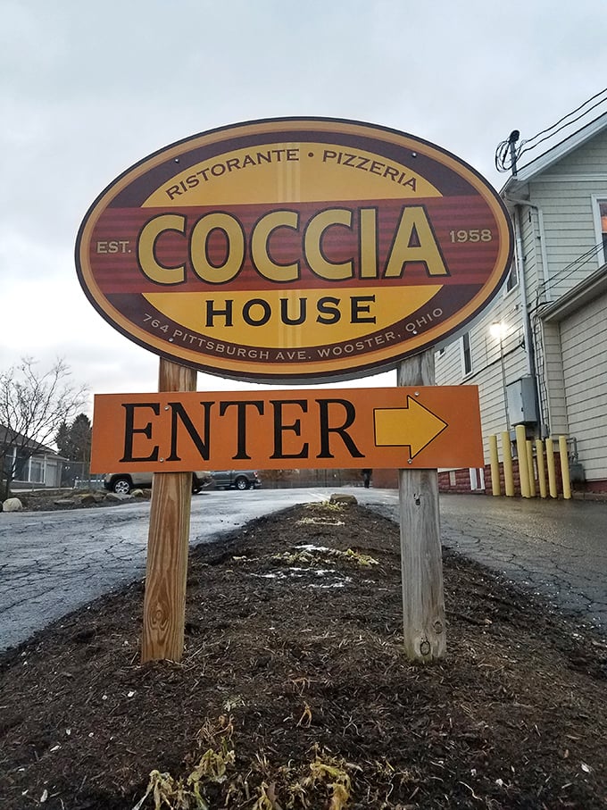 The welcoming sign that points you toward pizza paradise – follow that arrow to culinary happiness awaits.