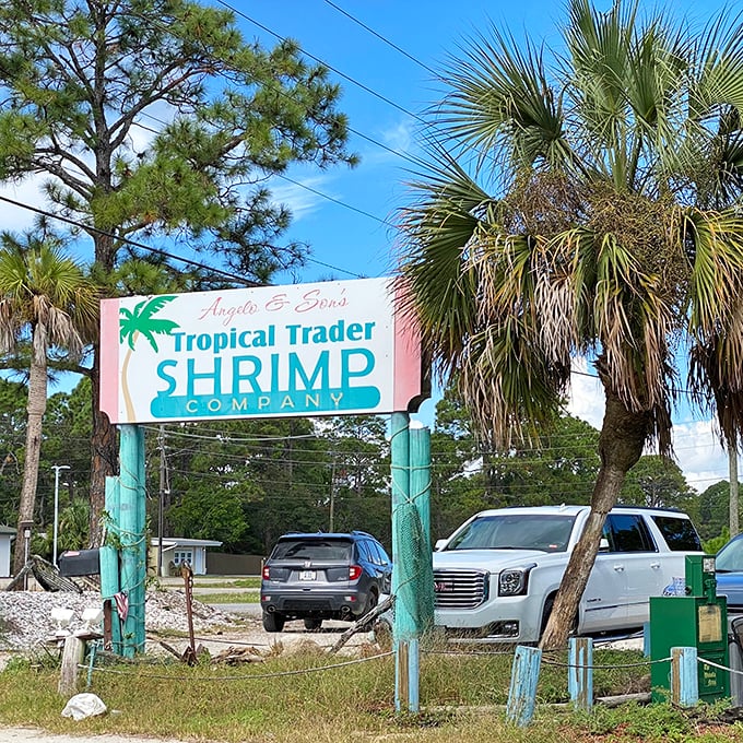 The roadside sign stands as a beacon for hungry travelers. Like a lighthouse guiding ships, it steers appetites toward seafood salvation.