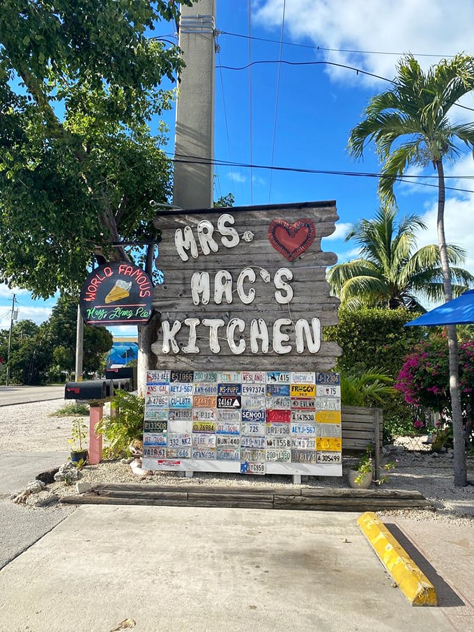 The sign says it all—Mrs. Mac's Kitchen isn't just a restaurant, it's a Keys landmark where license plates and memories stack up like pancakes.