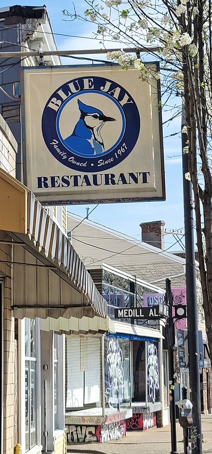 The Blue Jay sign stands proud against the Cincinnati sky, a beacon for those seeking authentic local flavor since 1967.