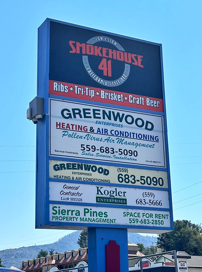 The roadside sign announces "Low & Slow California Style BBQ"—four words that together create a siren song for hungry travelers.