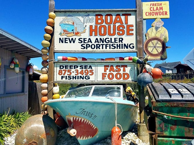 The sign announces your arrival at seafood nirvana—complete with a shark-mouthed boat that seems to say "we're serious about our fish."