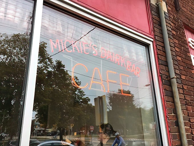 That neon "CAFE" sign in the window serves as a simple promise: enter here and leave happier, fuller, and planning your next visit.