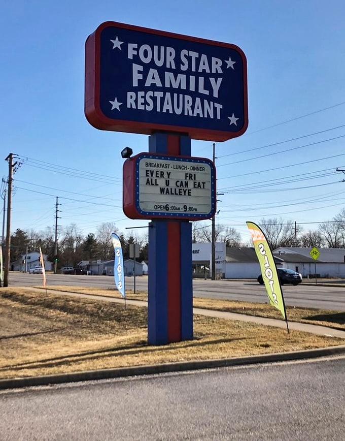The roadside sign doesn't just announce a restaurant—it's a beacon of hope for hungry travelers and a weekly bulletin board for walleye enthusiasts.