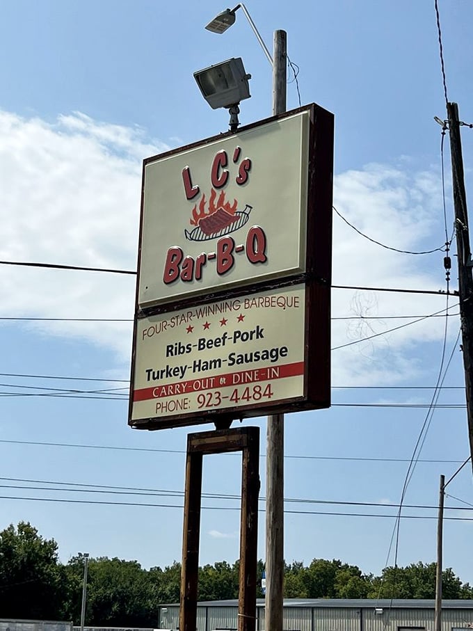The sign beckons like a smoky lighthouse, guiding hungry travelers to a port of barbecue salvation on Kansas City's culinary seas.
