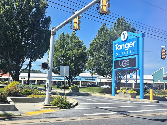 The iconic blue Tanger sign stands tall along Route 30, a beacon for bargain seekers and a landmark that says, "Your wallet is about to get lighter, but happier."