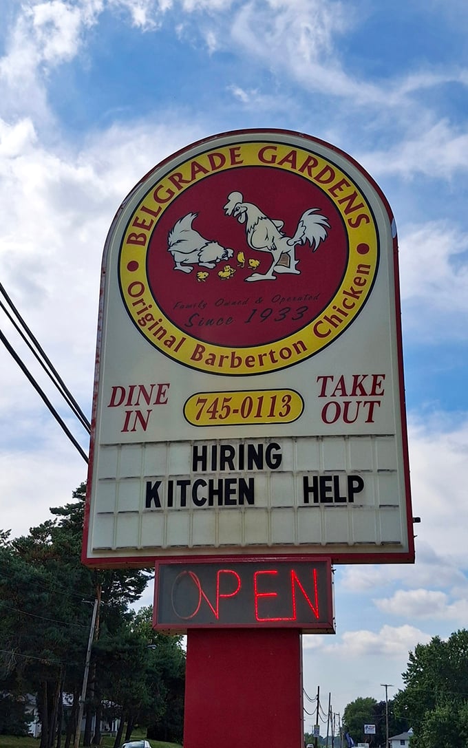 The roadside sign featuring a proud rooster announces what locals already know: you've arrived at the birthplace of Barberton chicken.
