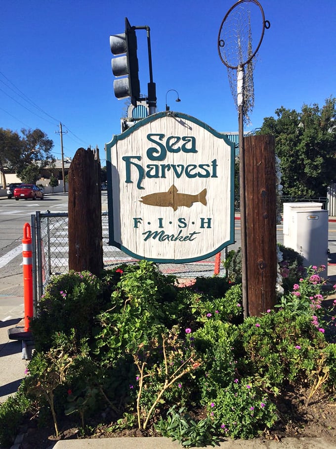 The sign that started a thousand satisfied stomachs—simple, honest, and pointing the way to happiness.