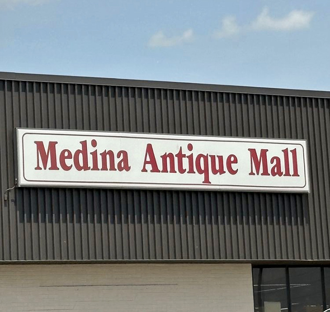 The classic signage of Medina Antique Mall promises adventures in antiquing. This unassuming exterior houses a universe of vintage treasures within.