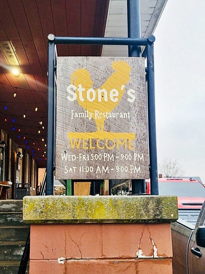 The rooster sign stands as a beacon of hope for hungry travelers. Follow the chicken to find the chicken—it's just good logic.