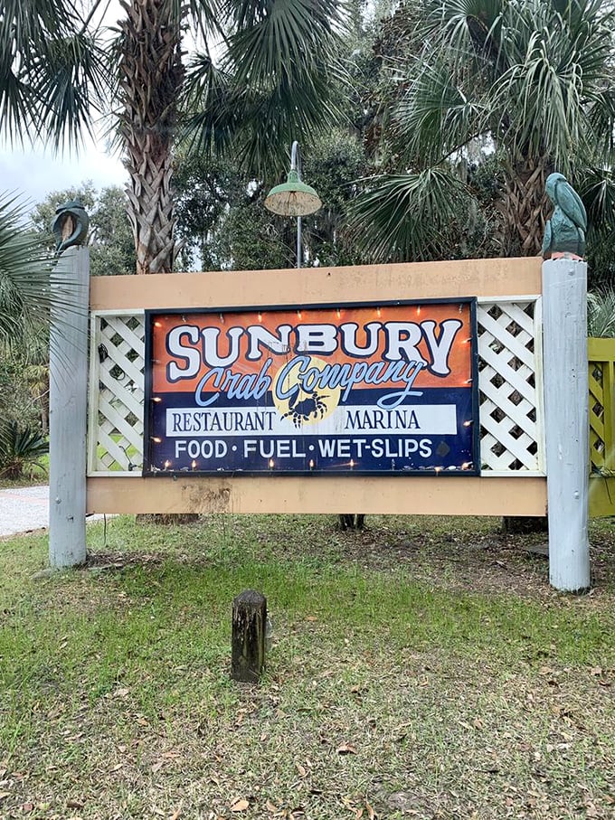 The sign promises three essentials for coastal happiness: food, fuel, and wet slips—a trifecta for both boaters and landlubbers.
