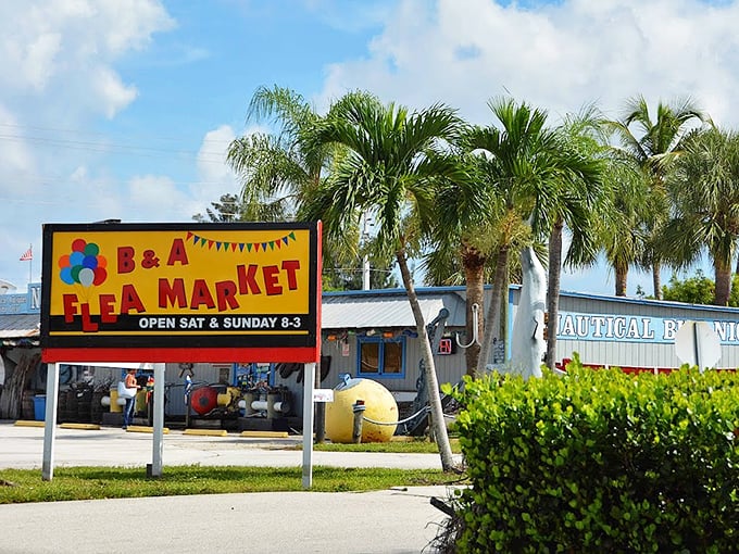 Palm trees frame the cheerful yellow sign announcing B&A Flea Market's weekend hours—Florida's version of "X marks the spot" for bargain hunters.