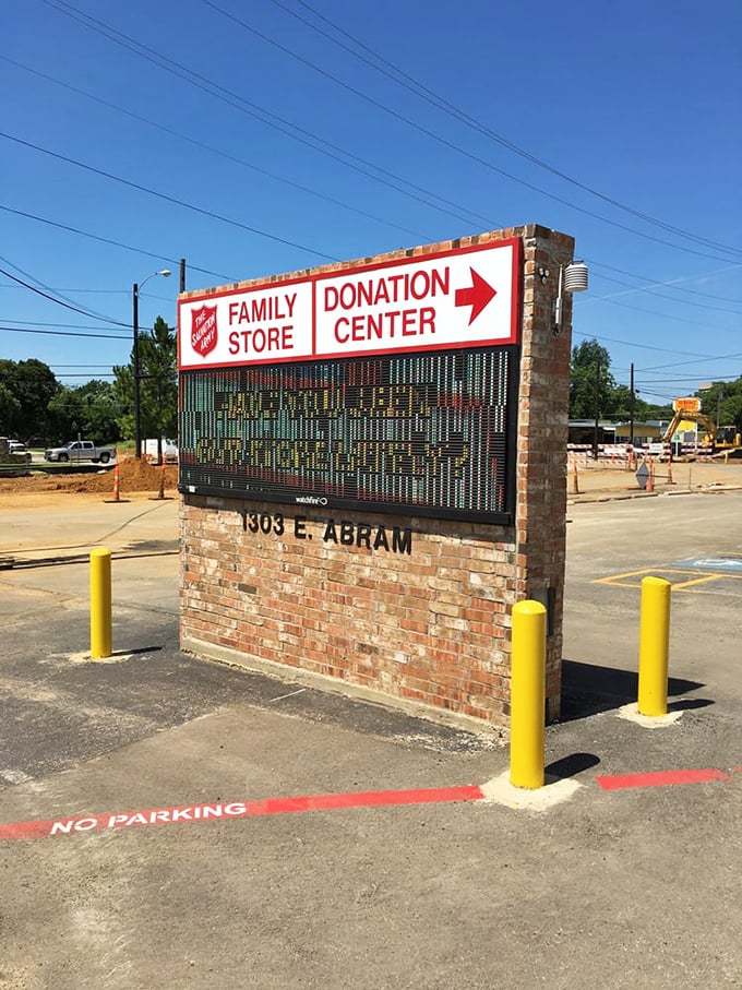 The sign says it all—one side for finding treasures, the other for giving them. The perfect circle of thrift store karma.