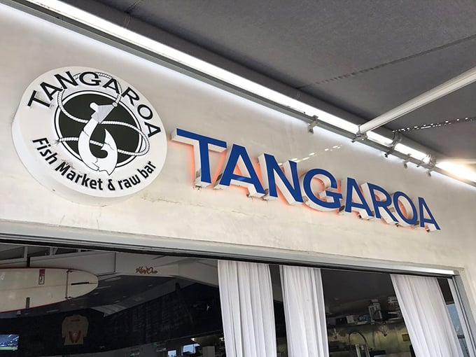 The sign promises "Fish Market & Raw Bar" – five simple words that translate to "Your seafood cravings end here."