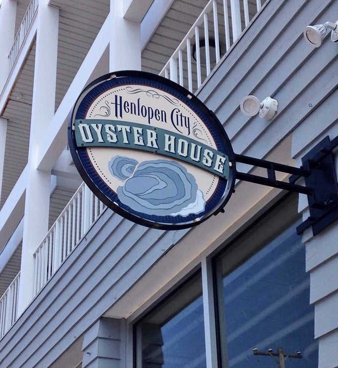 That iconic sign swinging gently in the sea breeze—a beacon for seafood lovers navigating Rehoboth's dining scene.