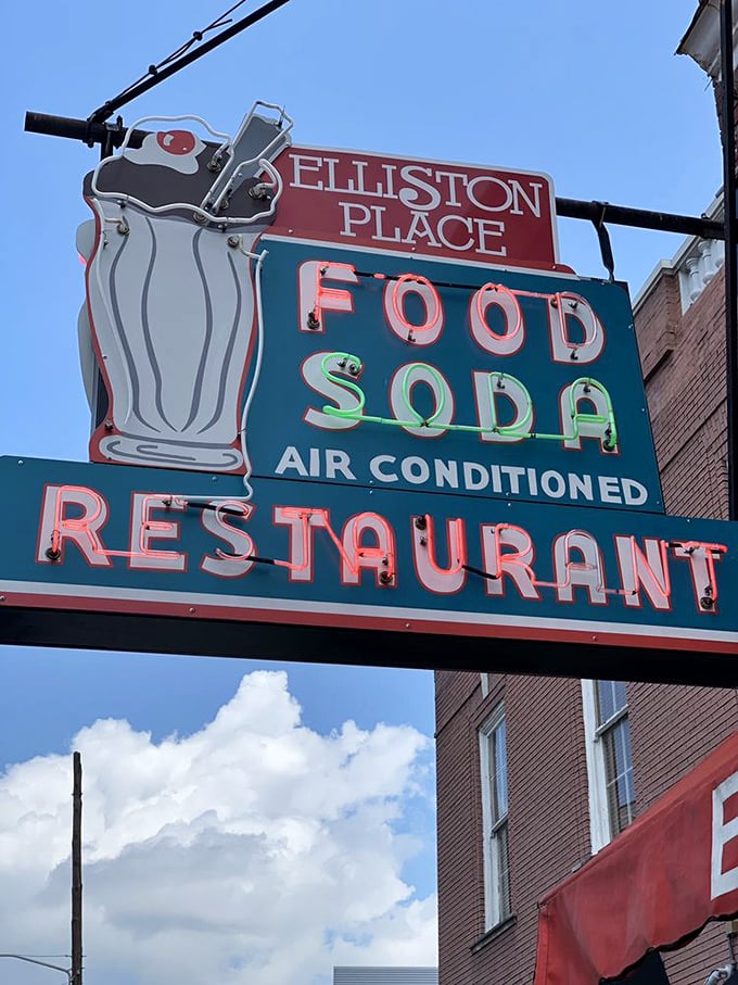 Not just a sign—a beacon of hope for the hungry, promising air conditioning, good food, and a temporary escape from adulting.