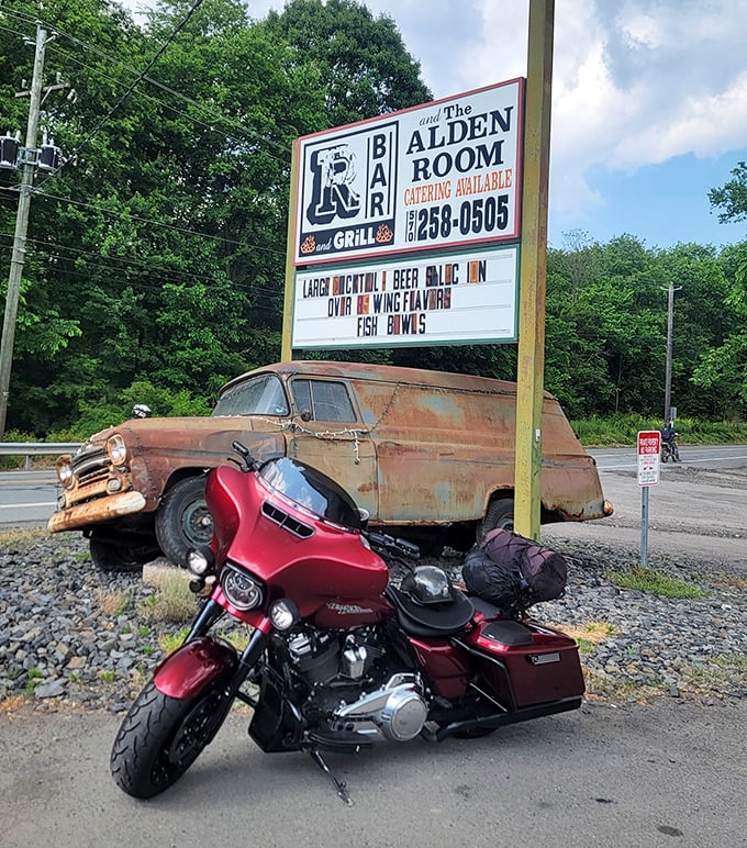 The sign that's guided hungry travelers for years, with that vintage vehicle adding just the right touch of rustic authenticity to your arrival experience.