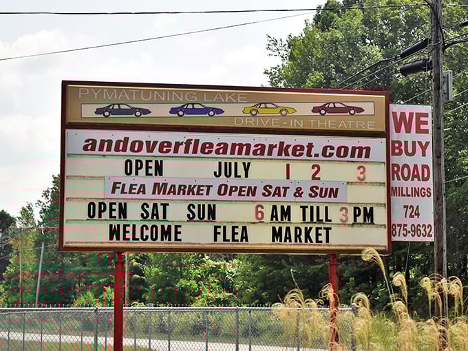 The marquee announces operating hours with nostalgic charm, sharing space with the Pymatuning Lake Drive-In—two American classics coexisting perfectly.