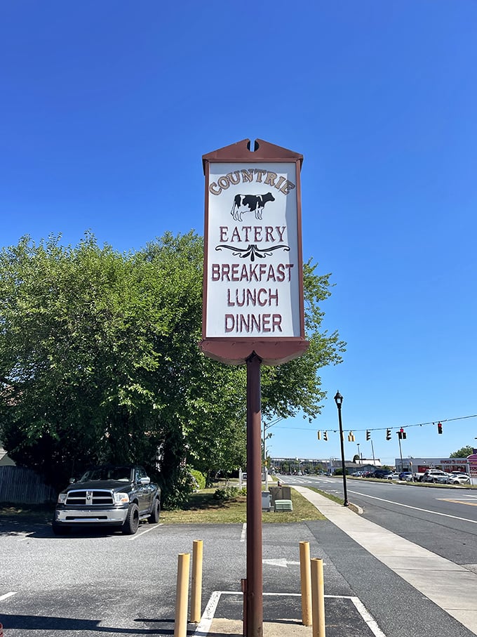 The roadside sign stands tall against blue skies, a beacon for hungry travelers seeking breakfast salvation in Dover.