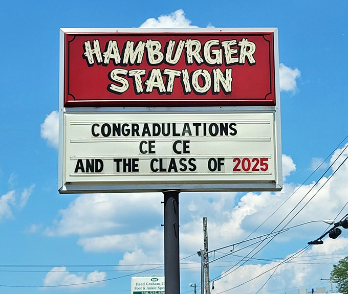 More than a sign—it's a community bulletin board. Where burgers and local milestones share equal billing under Ohio skies.