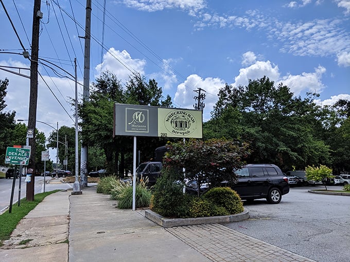 The sign stands as a beacon for hungry travelers, promising craft beer salvation just steps away from Atlanta's bustling streets.