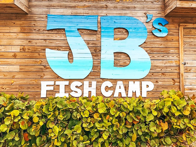 That ombré blue sign against weathered wood is more than decoration—it's a beacon calling hungry travelers home to seafood paradise.