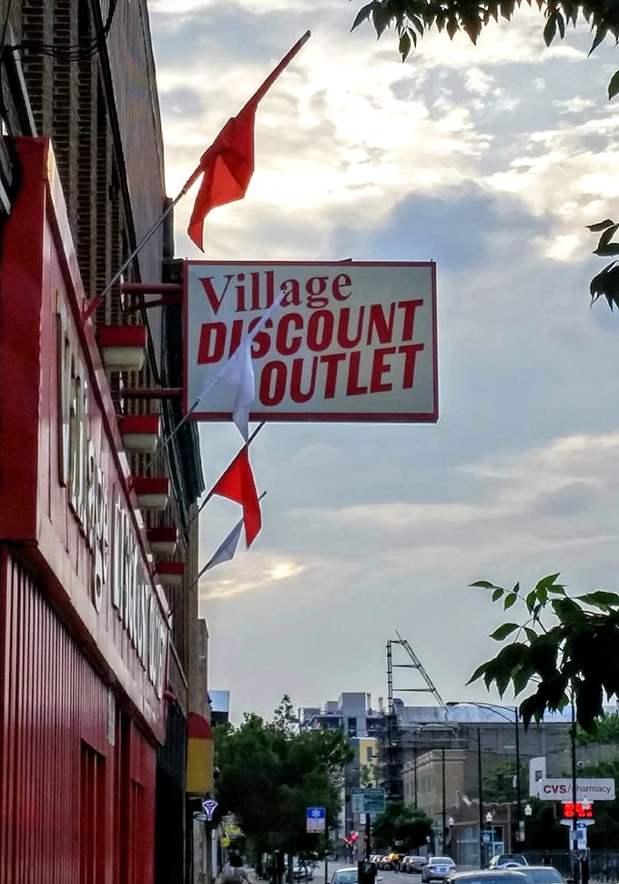 As dusk settles over Logan Square, Village Discount's sign glows like a North Star for the budget-conscious, promising tomorrow's treasures to those who return.