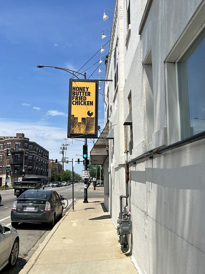 The signature yellow sign serves as a beacon for hungry travelers—Chicago's equivalent of the North Star for fried chicken pilgrims.