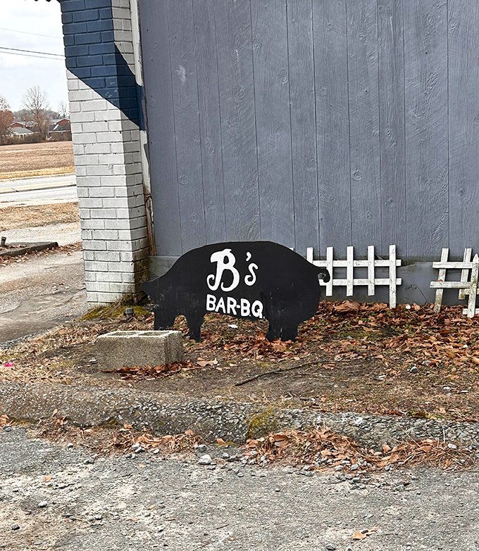 The pig silhouette sign—B's subtle way of saying "You've arrived at the promised land." Like a North Star for hungry travelers seeking pork perfection.