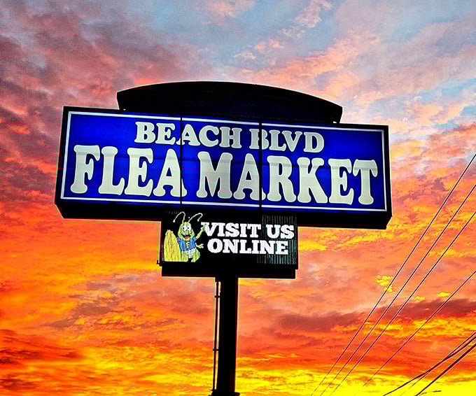 Sunset perfection frames the iconic sign, beckoning bargain hunters like a neon lighthouse guiding ships to retail salvation.